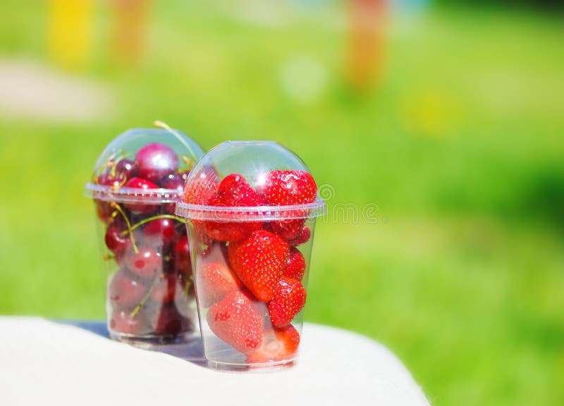 Berries in plastic cup stock photo. Image of fresh, juicy - 77090900