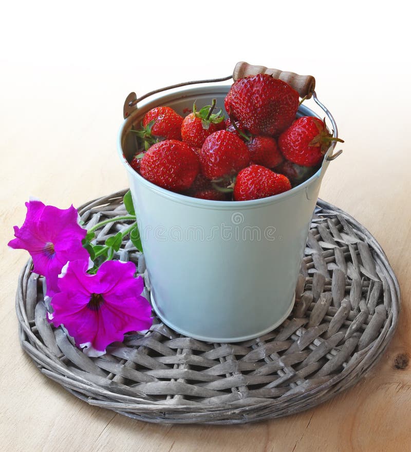 Berries of Strawberry in a Grey Bucket and Flowers Stock Image - Image ...