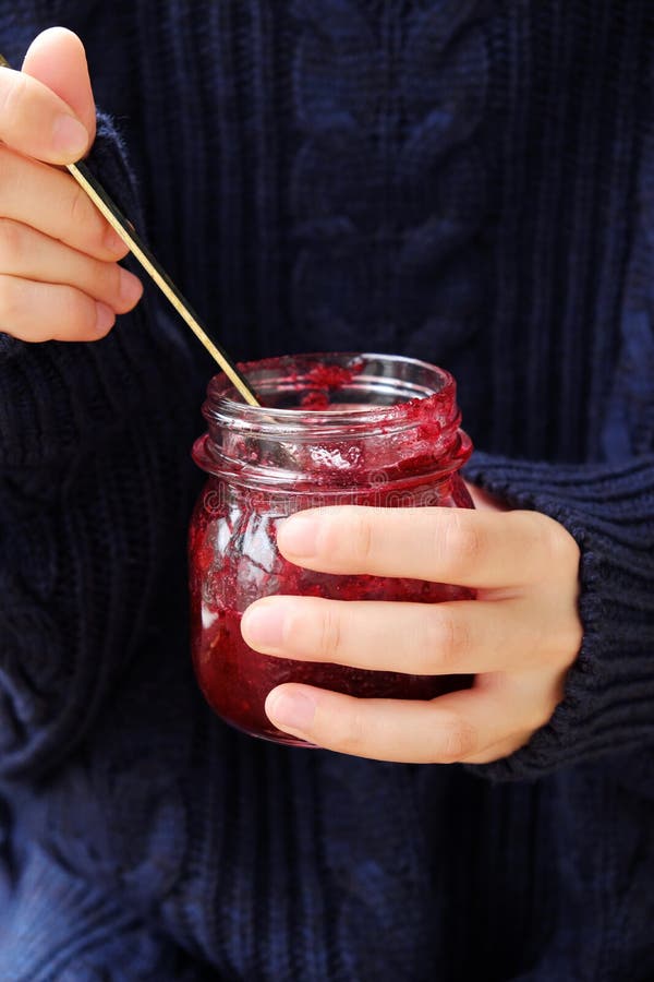 Berry Jam and Spoon in Hands View Stock Photo - Image of glass, girl ...