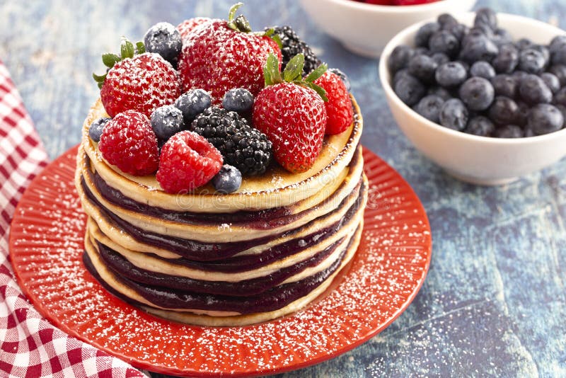 Berry Pancakes with Compote Spread on a Distressed Blue Wood Table ...
