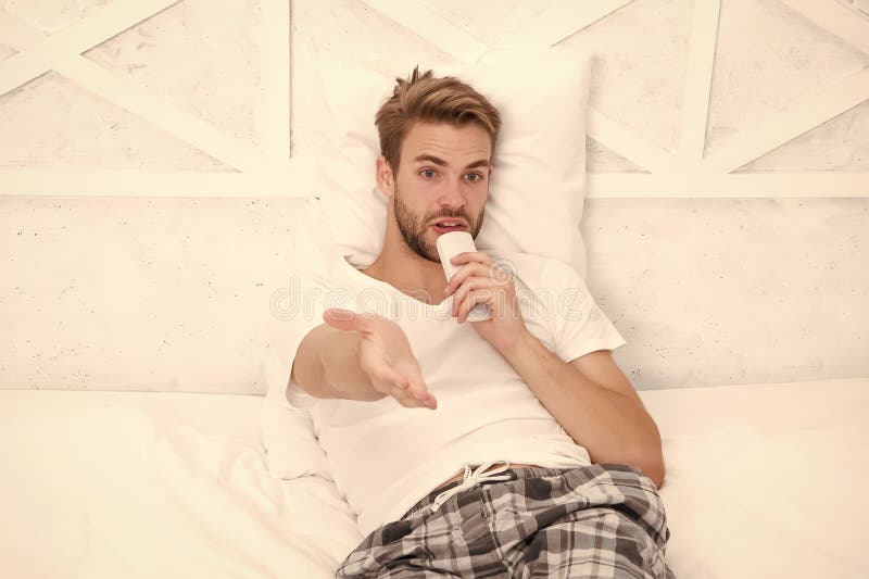 Best Alternatives To Cable TV. Handsome Man in Pajamas with Remote ... Best Alternatives To Cable TV. Handsome Man in Pajamas with Remote ...