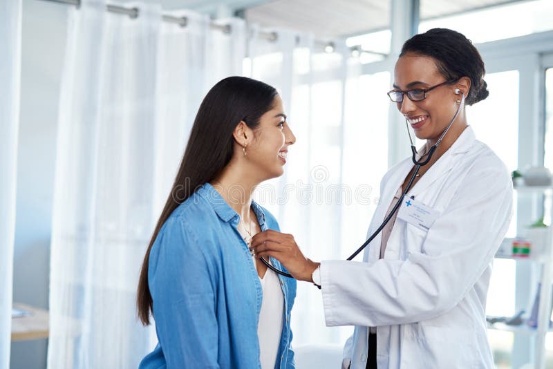 The Best In Cardiovascular Care A Young Doctor Examining Her Patient