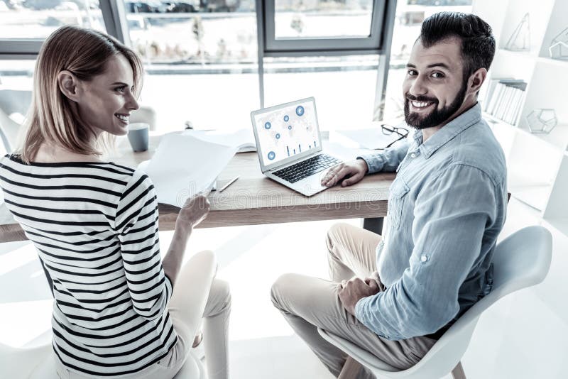 Pleasant Responsible Partners Sitting and Working Together. Stock Photo ...