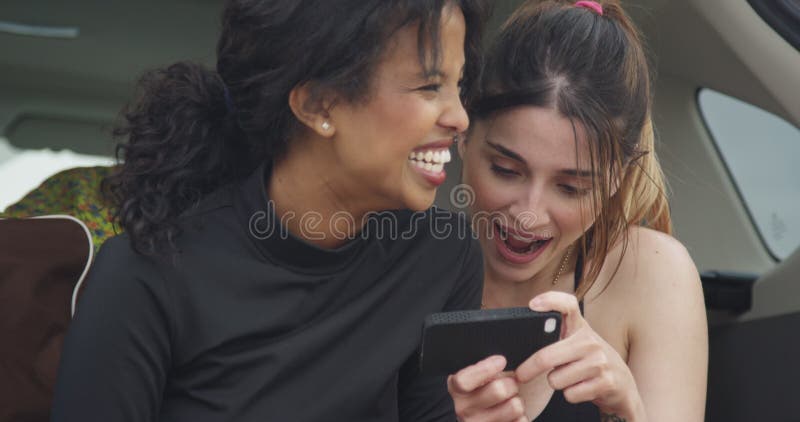 Best Friends Using Smartphone Laughing and Smiling Stock Video - Video ...