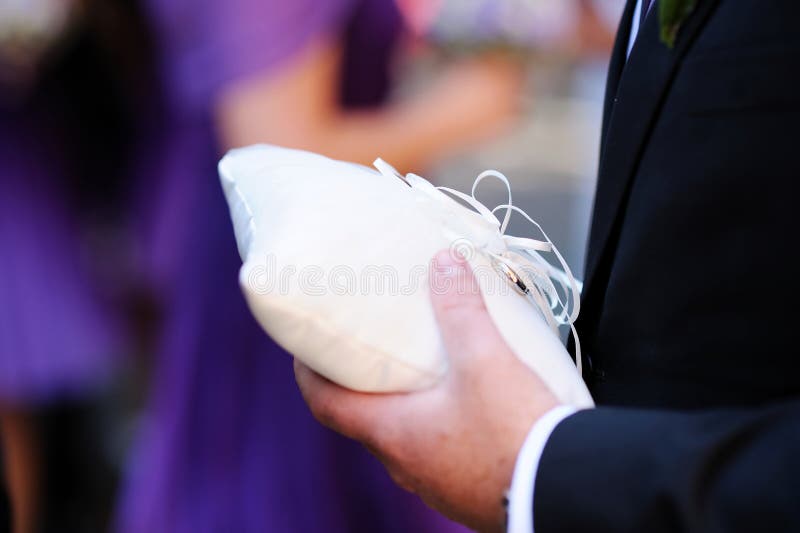 Best Man Holding a Pillow with Wedding Rings Stock Image - Image of ...