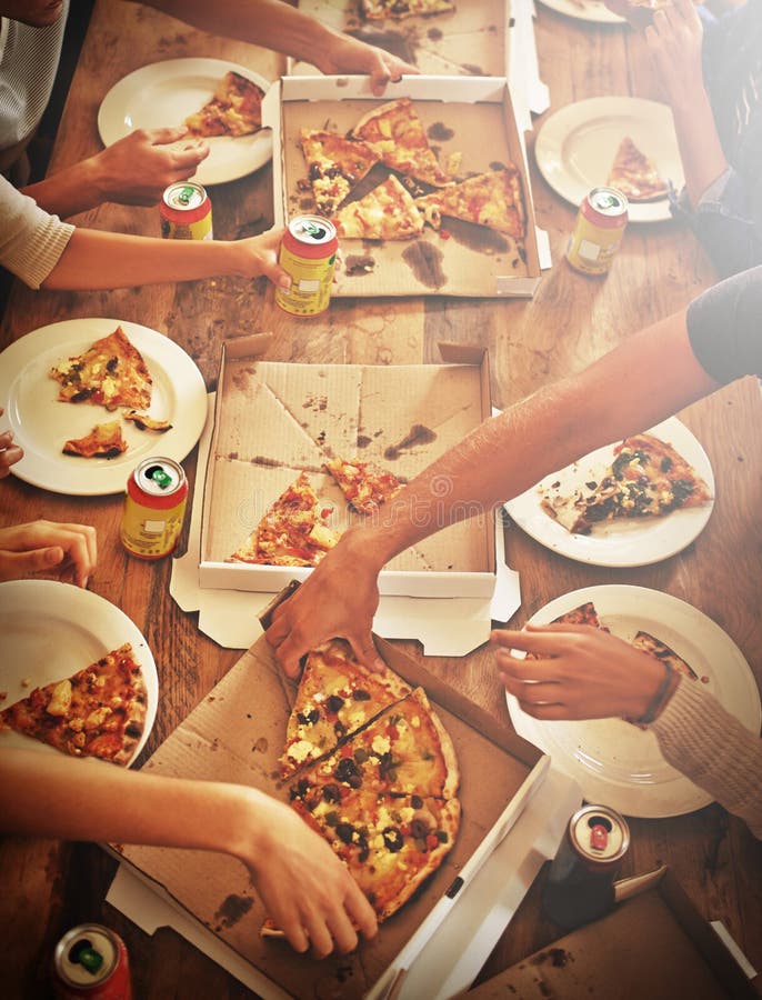 Best Pizza Ever. a Group of Friends Enjoying Pizza Together. Stock ...