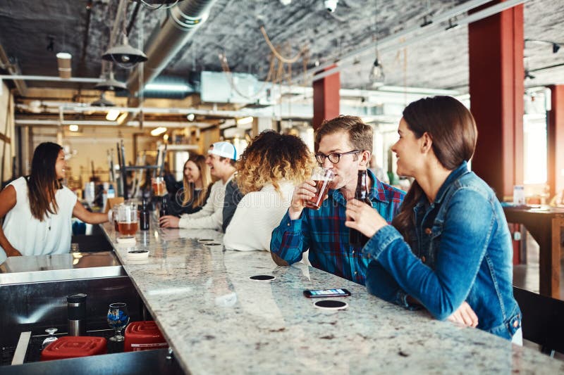 The Best Seat in the Bar. a Couple Enjoying a Drink at a Bar. Stock ...