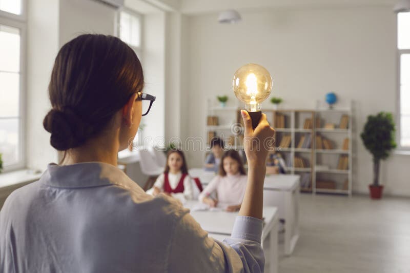 Best Teacher with Idea Light Bulb Inspires Elementary Children at ...