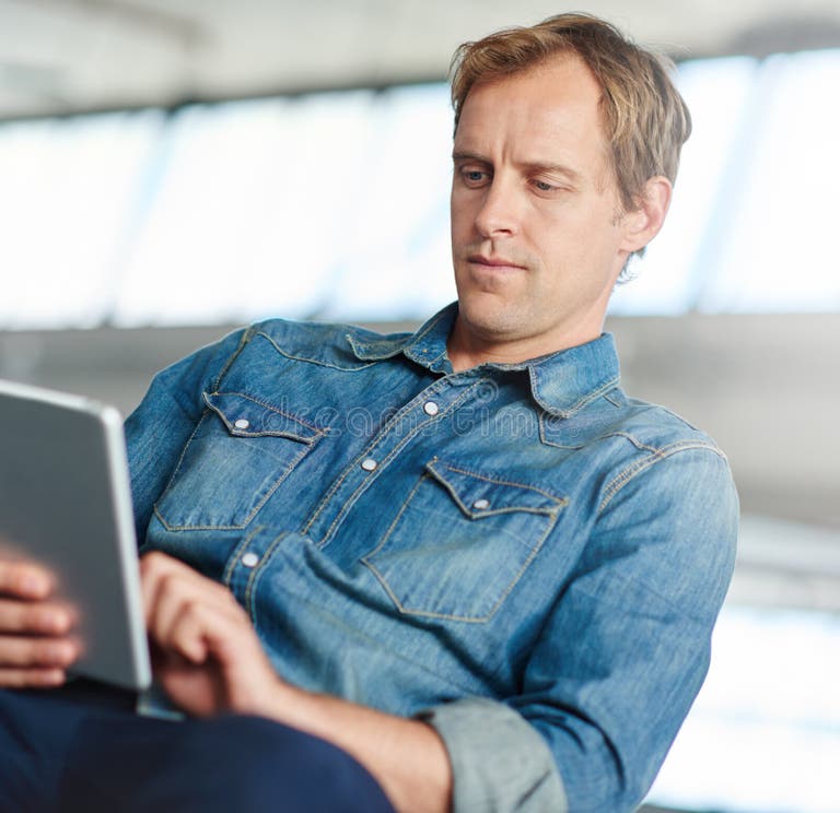 Beta Testing the New Mobi Site. a Handsome Young Man Using a Digital ...