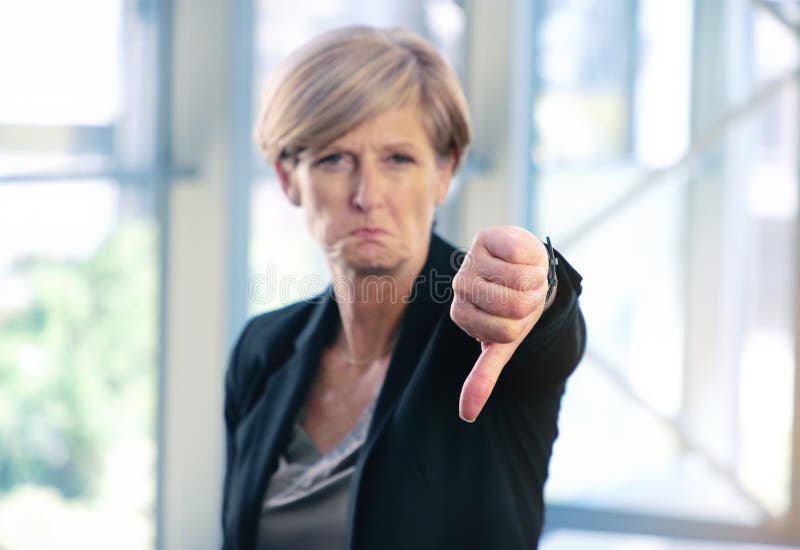 Better Luck Next Time. Portrait of a Mature Businesswoman Showing ... Better Luck Next Time. Portrait of a Mature Businesswoman Showing ...