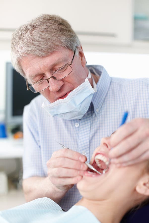 For Better Teeth. Portrait of Female Patient with Dentist Working on ...