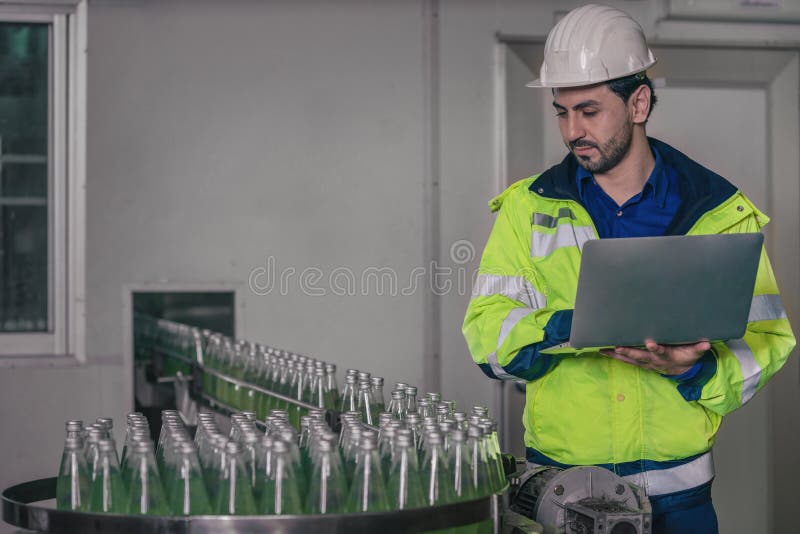 Beverage Factory Production Line Engineer Checking Production Line ...