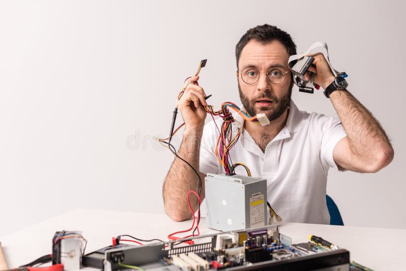 Bewildered Man Holding Wires and Computer Parts in Hands Stock Image ...