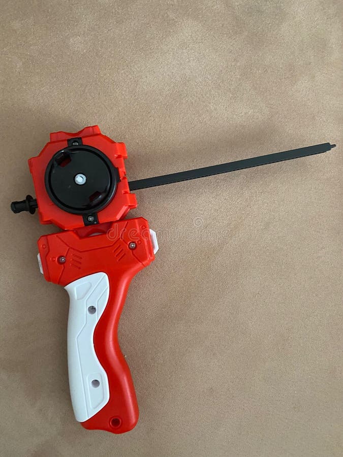 A Beyblade Launcher red stock photo. Image of launcher - 253992656