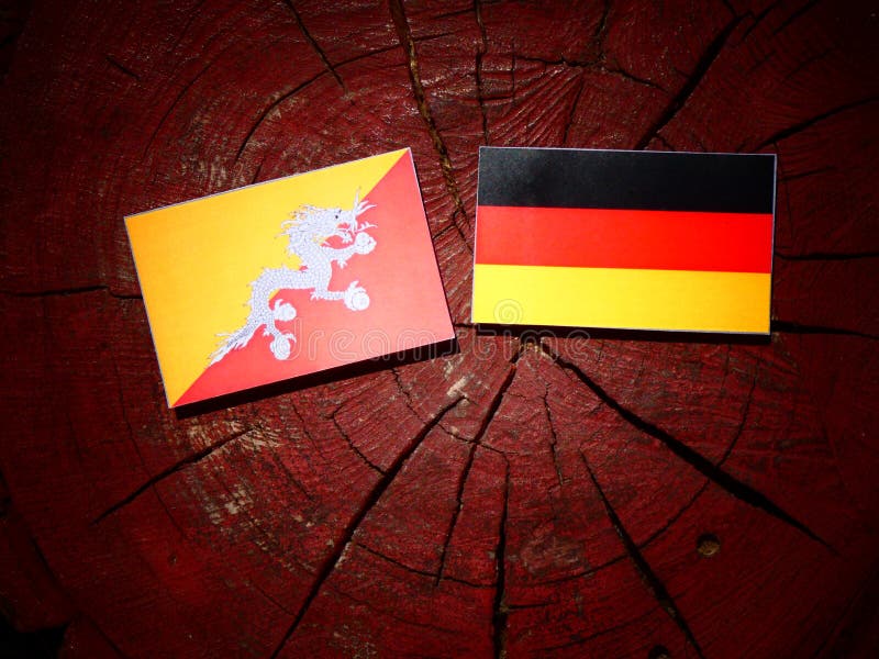 Bhutan Flag with German Flag on a Tree Stump Stock Image - Image of ...