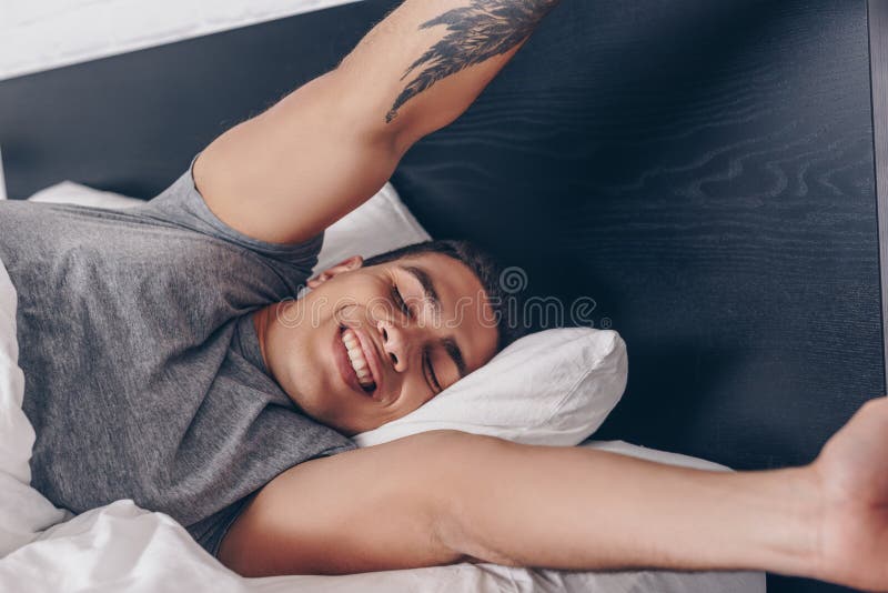 Bi-racial Man with Tattoo Stretching Stock Photo - Image of resting ...