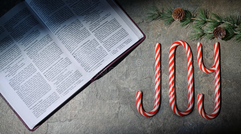 Bible and Joy Written with Candy Canes on Stone Table Stock Image ...