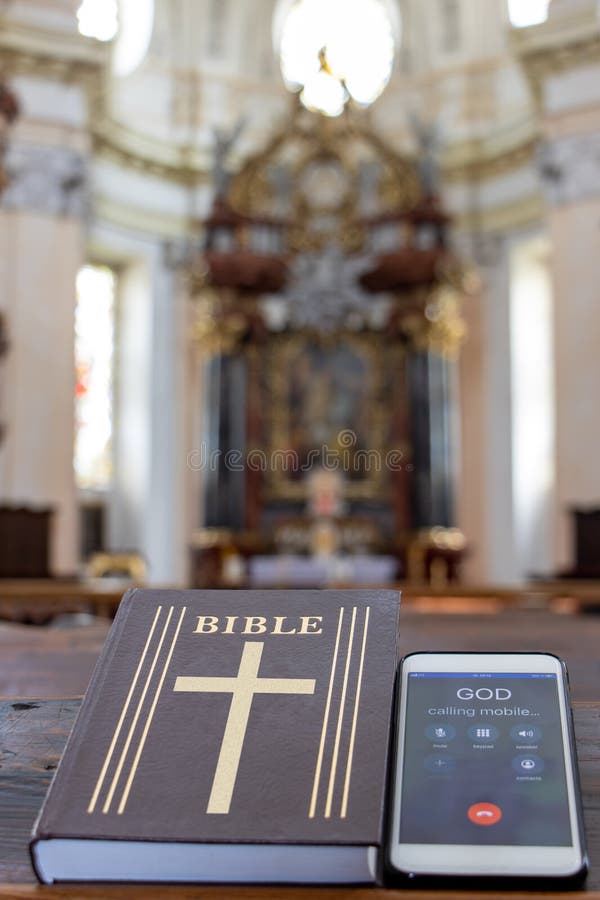 The Bible with Mobile Phone on the Table of a Prayer Bench in the ...
