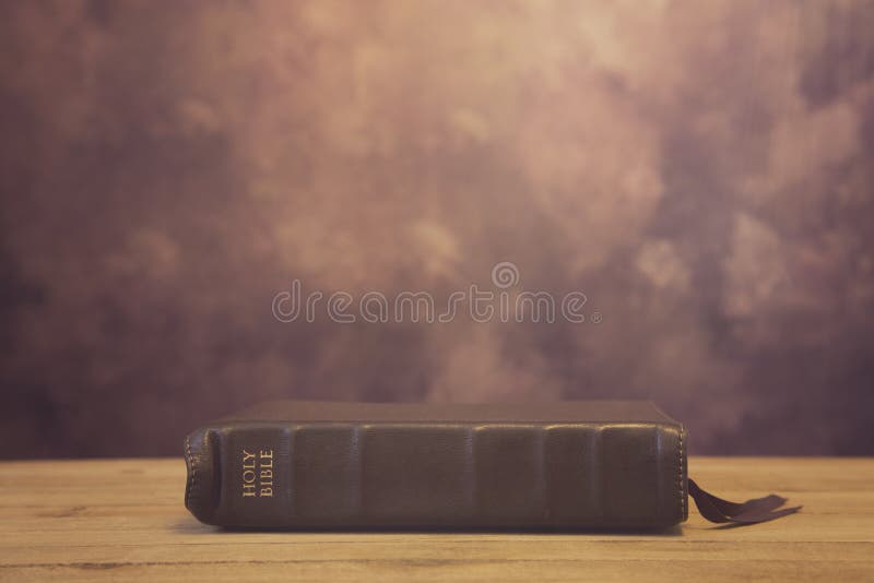 Bible on a Rustic Table stock photo. Image of table - 119607298