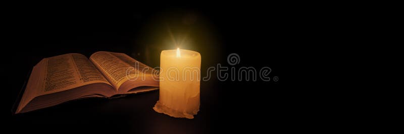 A Bible on the Table in the Light of a Candle Stock Image - Image of ...