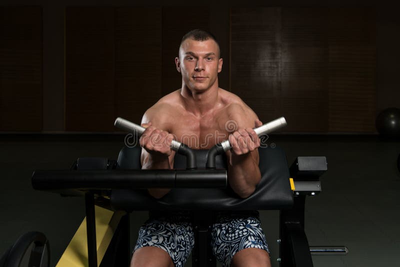 Biceps Exercises on a Machine Stock Photo - Image of machine, picking ...