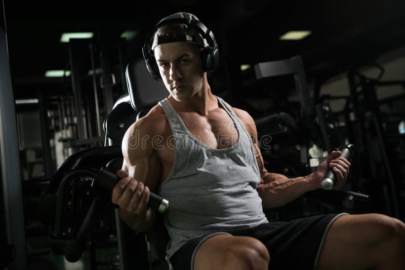 Biceps Exercises on a Machine Stock Image - Image of aerobics ...