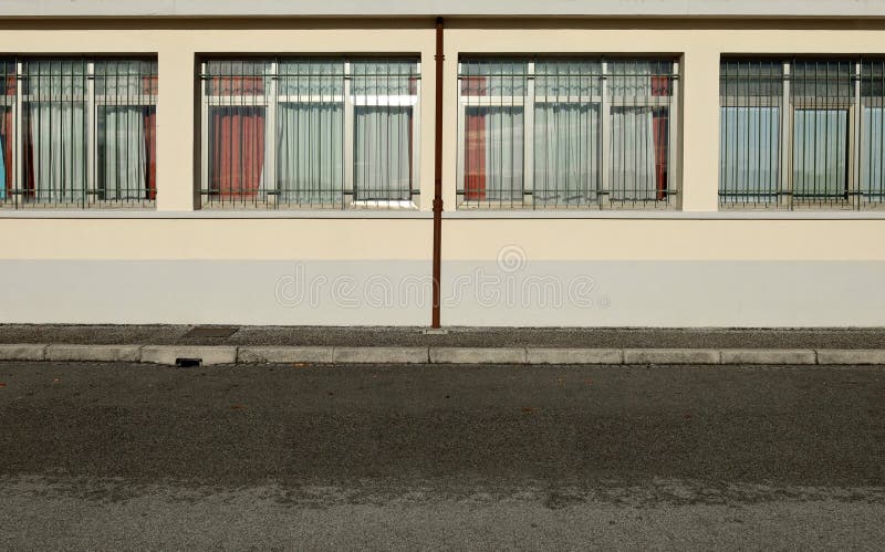 Bicolor Plaster Wall with Large Windows Protected by Security Grilles ...