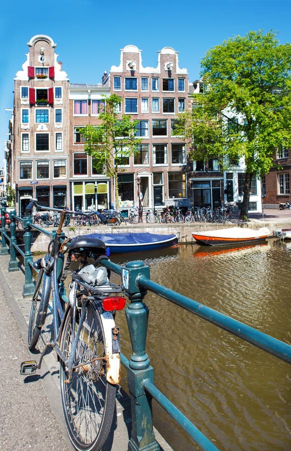 Bicycle on Amsterdam Bridge Stock Image - Image of enjoy, tourism: 31565103