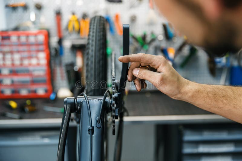 Bicycle Repair in Workshop, Man Checks the Tires Stock Image - Image of ...