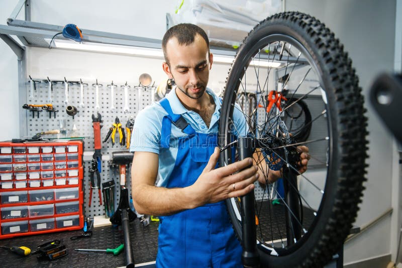Bicycle Assembly in Workshop, Man Setting Up Chain Stock Photo - Image ...
