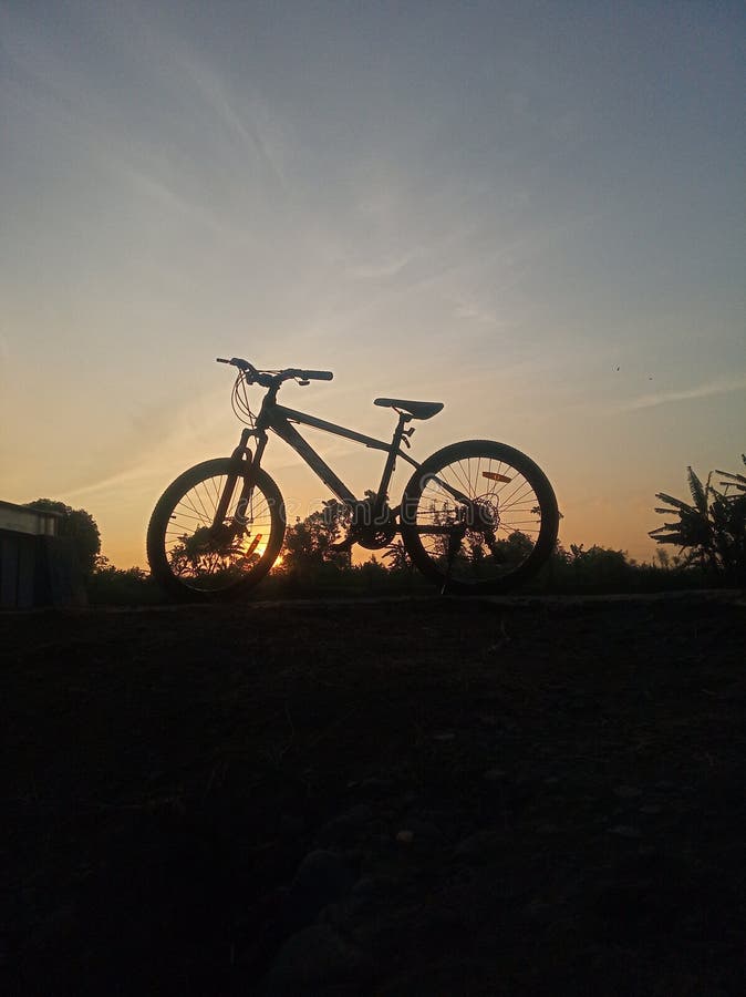 Bicycle Behind the Rising Sun Stock Photo - Image of vehicle, poster ...