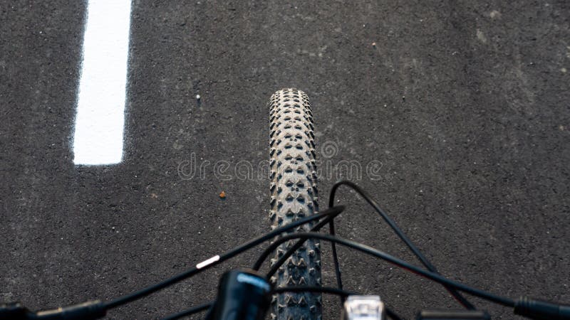 Bicycle on the Bike Path Top View of the Front Wheel. Stock Photo ...