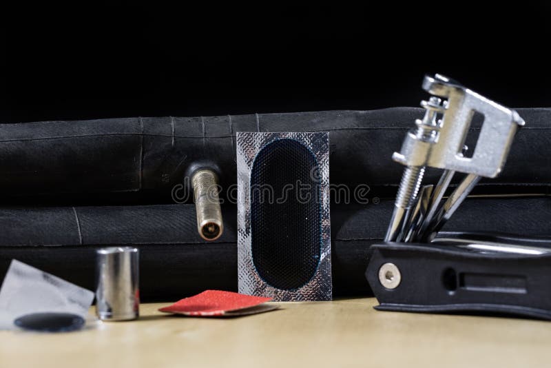 Bicycle Breakdown during the Trip. Sticking a Bicycle Tube in a Stock ...