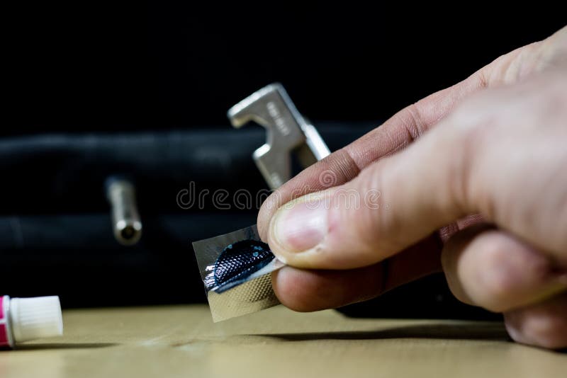Bicycle Breakdown during the Trip. Sticking a Bicycle Tube in a Stock ...