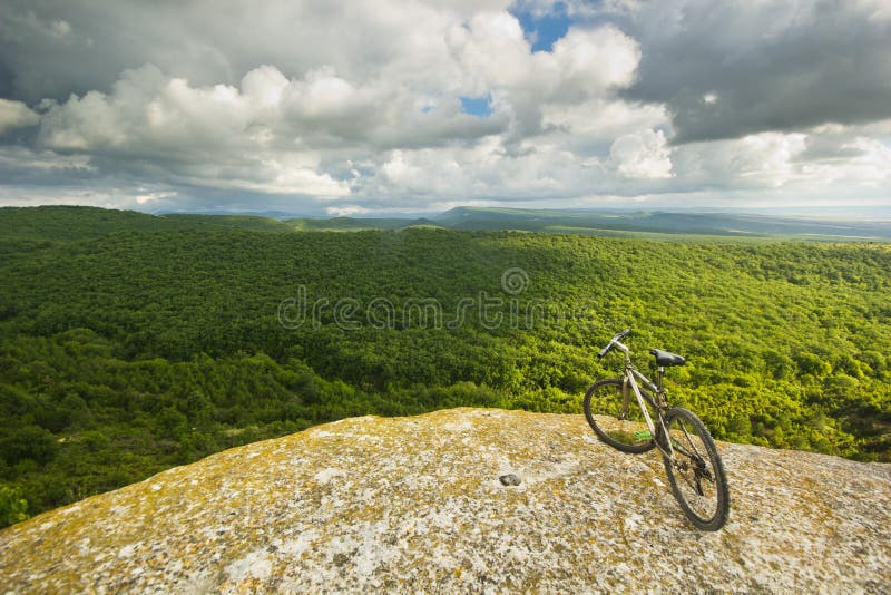 Bicycle on a Cliff with Covered by Forest Hills Stock Image - Image of ...