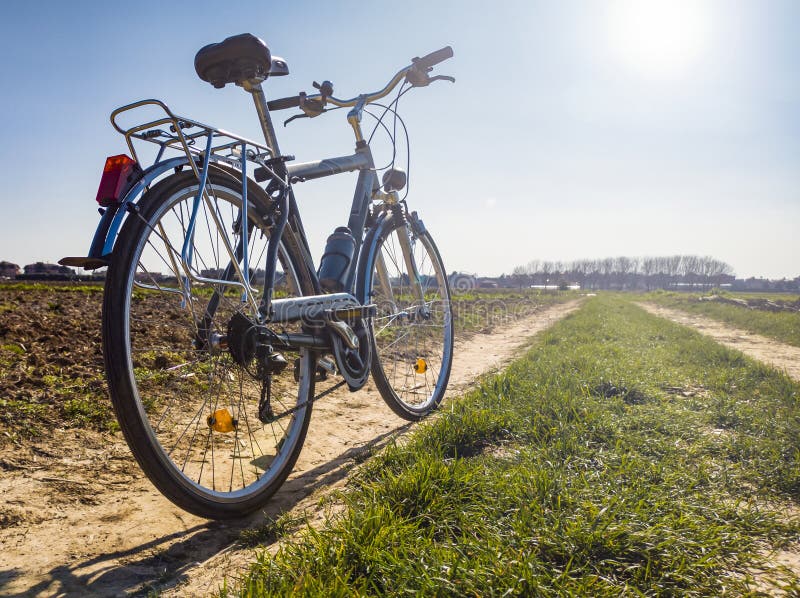 Bicycle on a country road stock photo. Image of green - 221602512