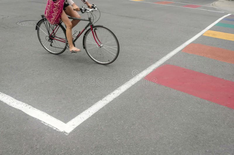 A Bicycle is Crossing a Rainbow Colored Pedestrian Path Stock Photo ...