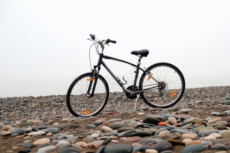 Bicycle on the empty beach stock photo. Image of travel - 257681130