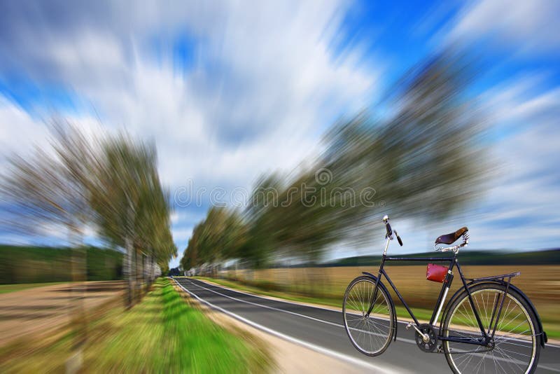 Bicycle on a highway stock image. Image of drive, green - 25696431