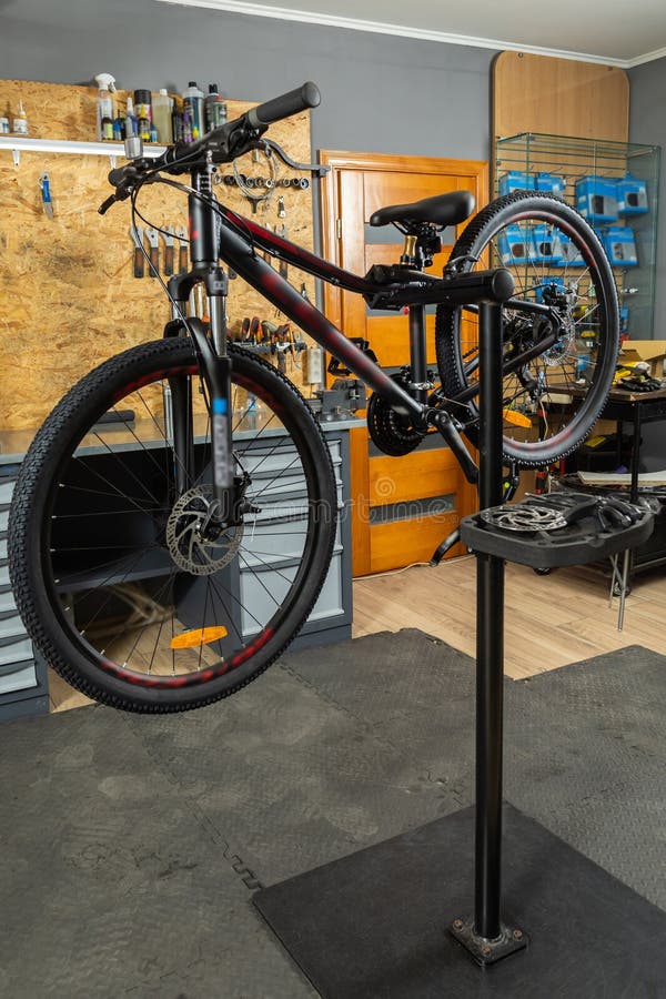 Bicycle in Home Garage Workshop on Stand Surrounded by Tools and ...