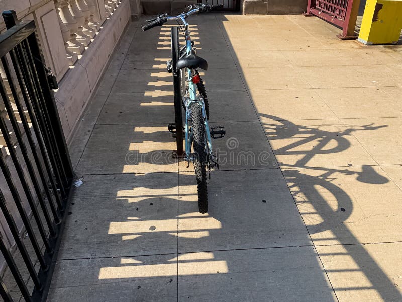Bicycle and Its Shadow on LaSalle Bridge in Chicago Loop during Evening ...