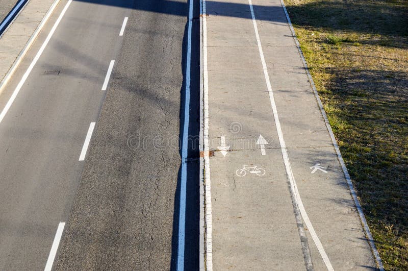 Bicycle Path Drawn on the Asphalt Road. Lanes for Cyclists. Traffic ...