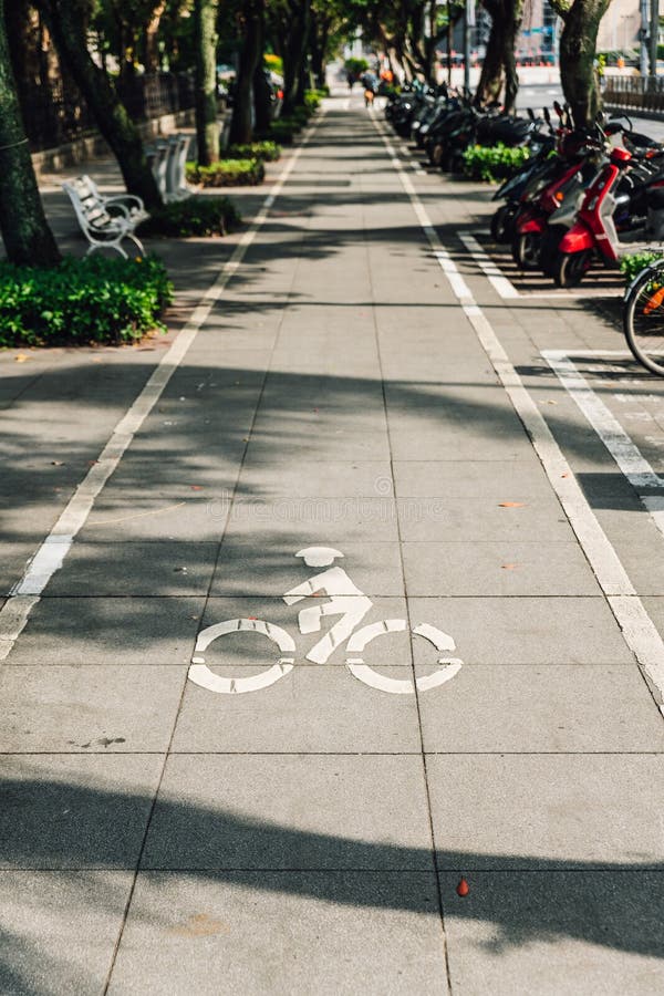 Bicycle Lane Mark on Footpath with Light and Shadow of Trees in Taipei ...