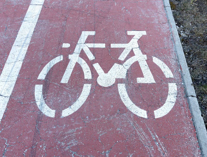 Bicycle Lane Symbol on Worn Red Asphalt Road in Urban Setting Stock ...