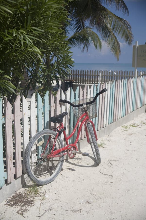 Bicycle Leaned Up Against a Colorful Picket Fence Stock Image - Image ...