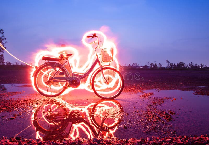 Bicycle light painting stock image. Image of fiery, round - 49586633