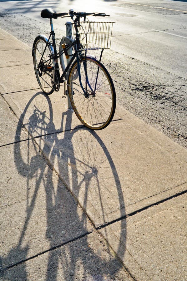 Bicycle Locked To the Rack and Its Shadow Stock Image - Image of ...