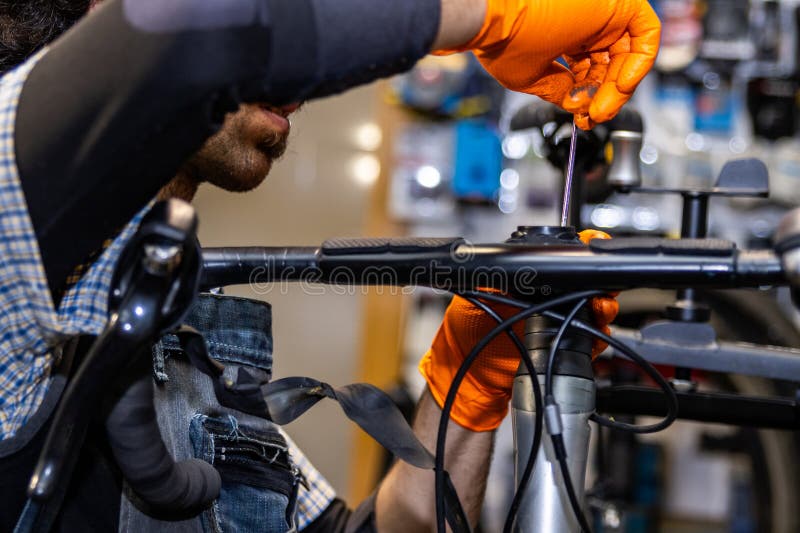 Bicycle Mechanic Repairing Handlebars in Workshop Stock Photo - Image ...