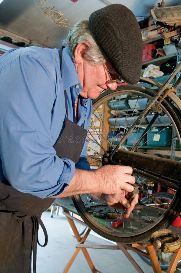 Bicycle mechanic at work stock image. Image of hands - 45730569