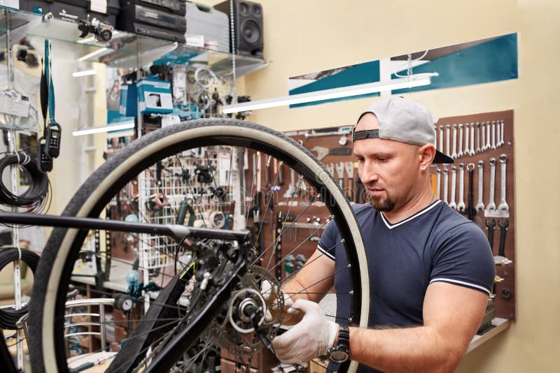 Bicycle Mechanic in a Workshop in the Repair Process Stock Image ...